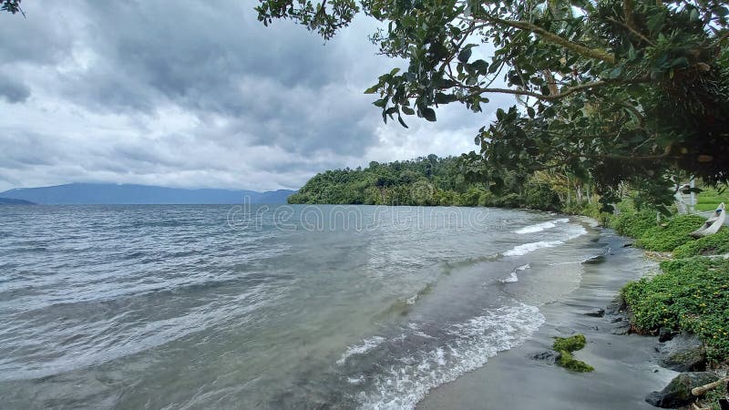 The beach of ranau lake stock photo. Image of tree, wave - 265562178