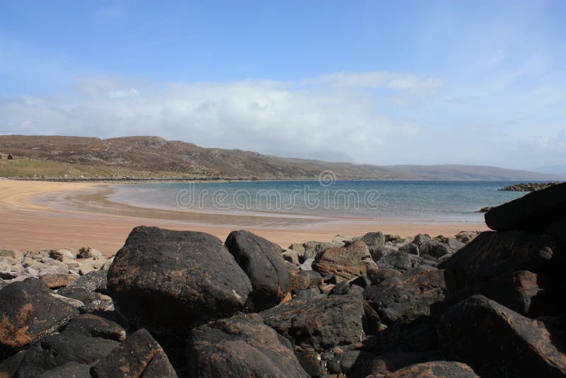 The Beach at Red Point with Rocks Stock Image - Image of rocks, hills ...