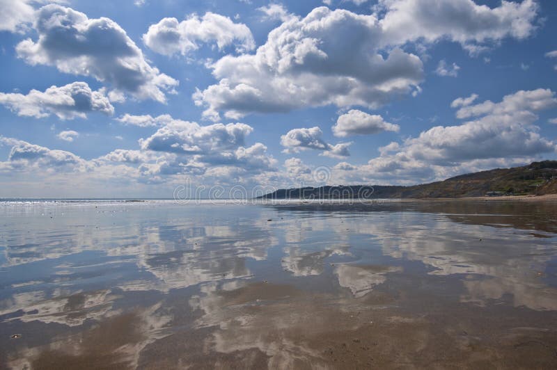 Beach Reflections stock image. Image of rock, beach, coastline - 36423771