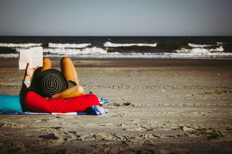 Beach Relaxation stock photo. Image of ocean, sand, reading - 92572316