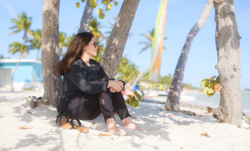 Beach Relaxation Woman Enjoying Serenity Under Palm Tree On Smathers Beach In Key West Fl
