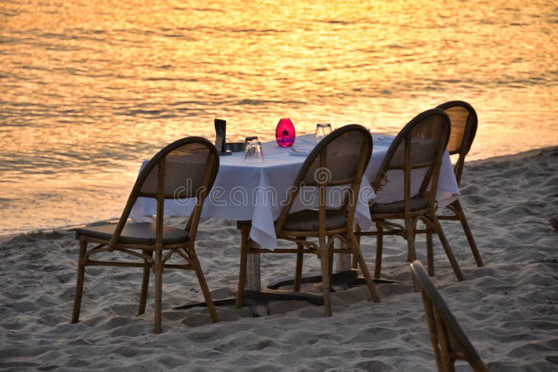 Beach restaurant sunset stock photo. Image of restaurant - 127219410