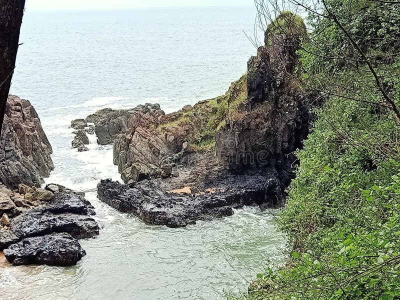 Beach with rocks stock photo. Image of rocks, tree, wave - 180406586