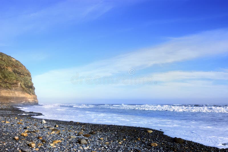 Beach With Rocks At Sunset In Zeeland, The Netherlands Stock Photo ...