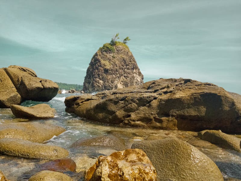 Beach with Rocks and Coral. Beautiful Scenery with Calm Waves Stock ...