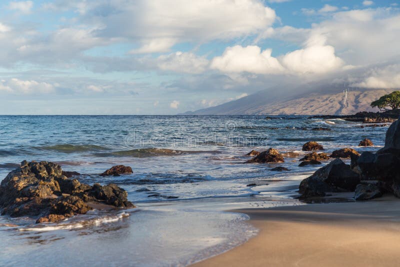 The Beach and Rocks in Maui Hawaii Stock Image - Image of hawaii, green ...