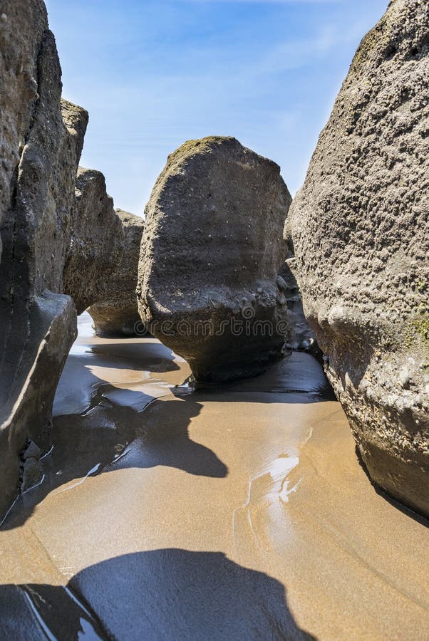 Beach rocks in the sand stock photo. Image of material - 112857374