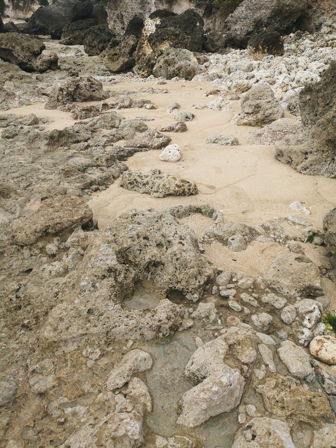 Sand with rocks stock photo. Image of bedrock, geology - 203851378