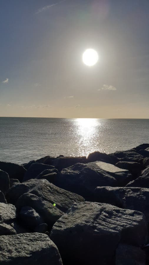 This beach rocks! stock image. Image of reflecting, beach - 136939113