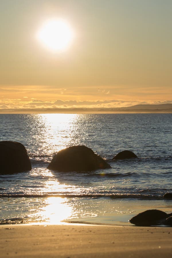 Beach and Rocks during the Sunset Stock Image - Image of tasmania ...