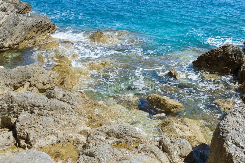 Beach with rocks in water stock photo. Image of scenic - 279107836