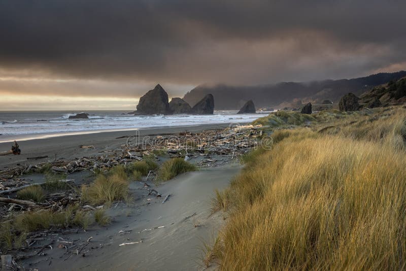 A Beach with a Rocky Shoreline and a Cloudy Sky Stock Image - Image of ...