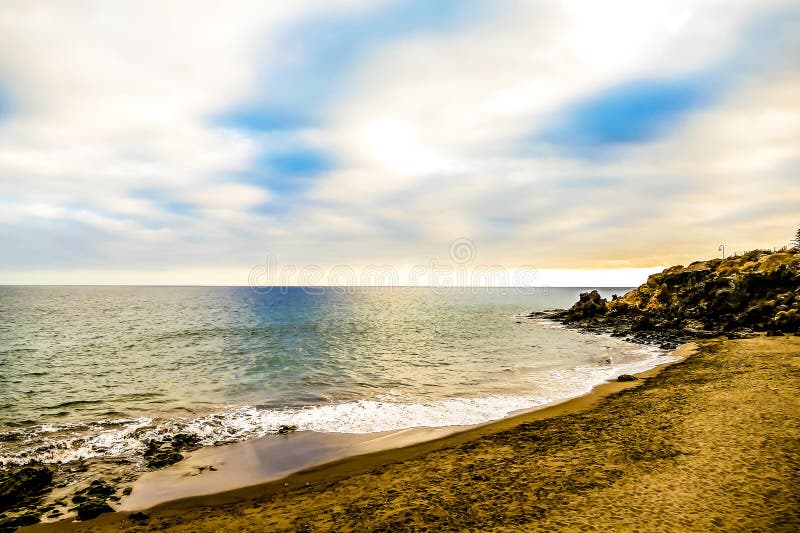 A Beach with a Rocky Shoreline and a Cloudy Sky Stock Photo - Image of ...