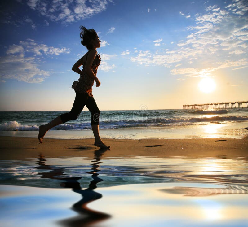 Woman running on the beach stock image. Image of lifestyle - 1879117