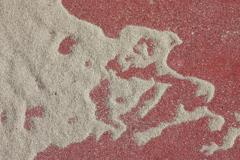 Beach Sand Blown Onto Red Payment by the Wind Stock Photo - Image of ...