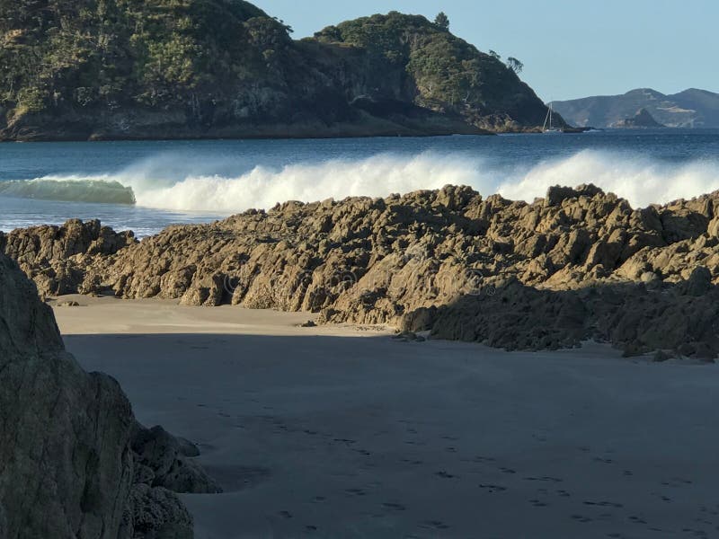 Beach with Sand Piles and Waves Approaching in the Background Stock ...