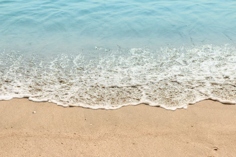 Beach sand with sea wave stock photo. Image of blue - 138288122