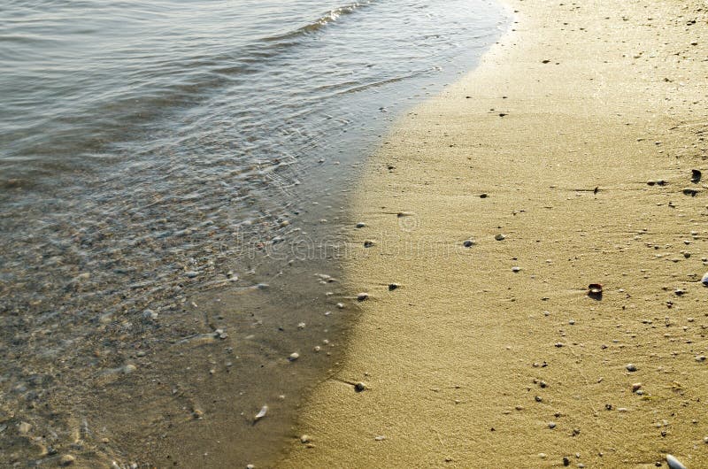 Beach with sand and water stock photo. Image of ripple - 47353042
