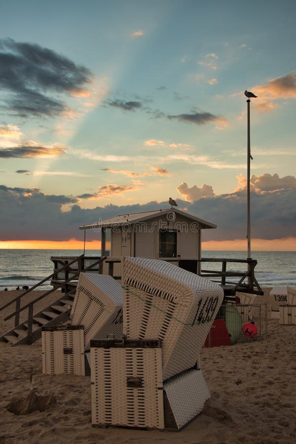 Beach Scene in Evening Sun Rays Stock Photo - Image of lifeguard ...