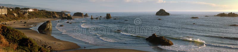 Beach scene with rocks stock photo. Image of houses, panoramic - 10755136