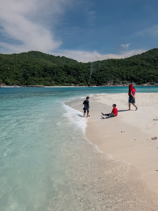 Beach scene in a sunny day stock photo. Image of holiday - 264824232