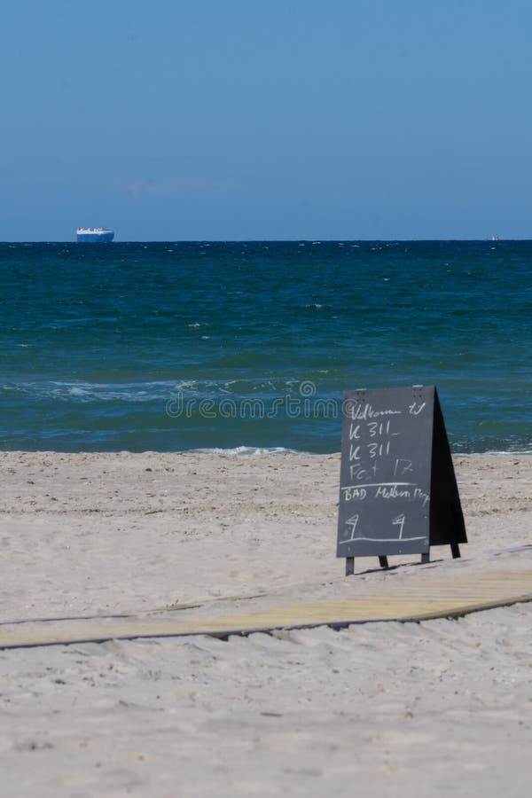 Beach, sea and cargo ship stock image. Image of ship - 96344307