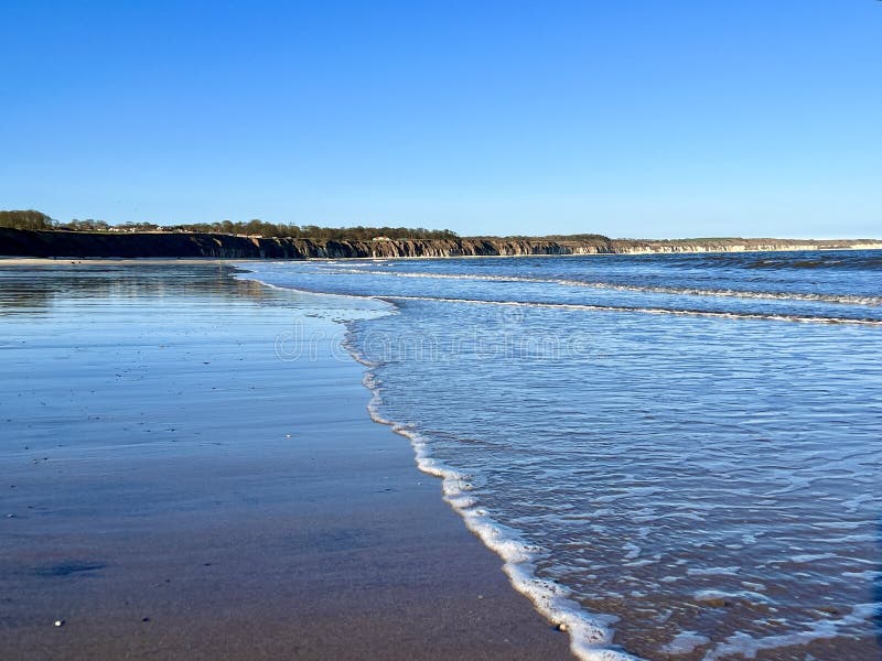 Beach stock photo. Image of ocean, cliff, water, shallow - 273259936