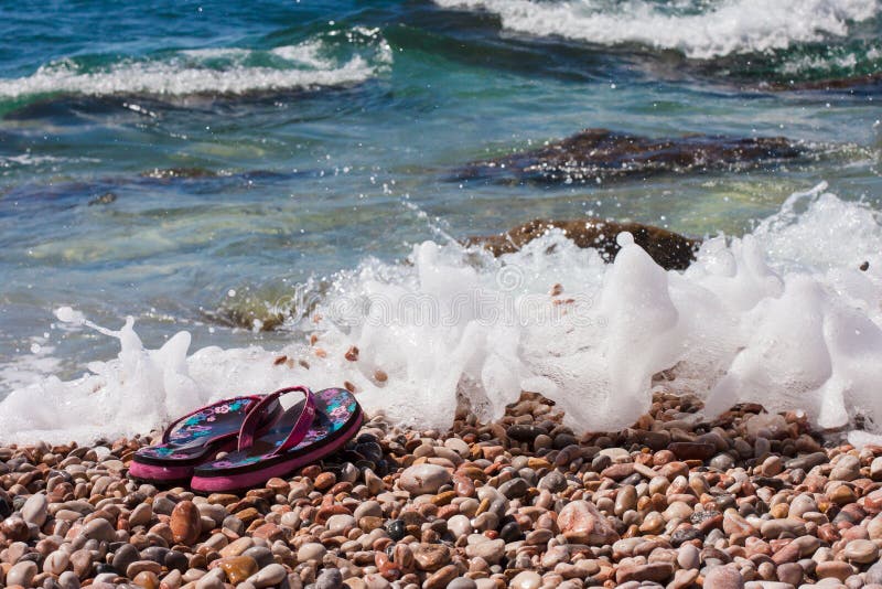 Beach Shoes on the Sea Pebbles in Waves Stock Image - Image of vacation ...
