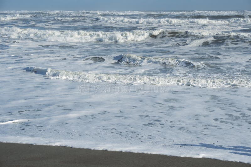 Tides are Coming in To the Shoreline Under a Vibrant Sunset Stock Photo ...