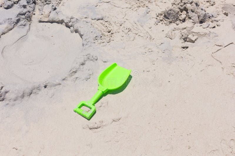 Beach Shovel Stuck in the Sand Stock Photo - Image of bucket, childhood ...