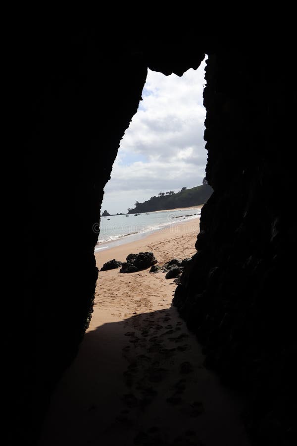 Beach side cave stock photo. Image of reflection, light - 217080138