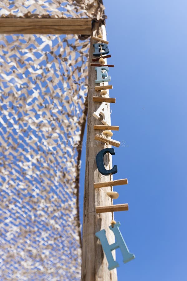 Beach Sign. Wooden Letters Hanging from a Post Stock Photo - Image of ...