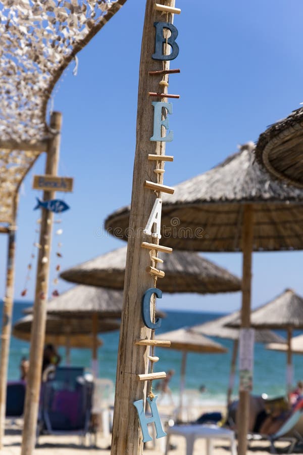 Beach Sign. Wooden Letters Hanging from a Post Stock Image - Image of ...