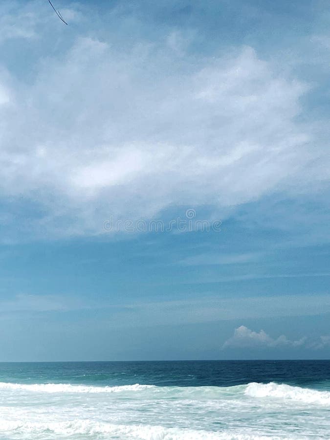 The Beach and Sky Look Together because they are the Same Blue Stock ...