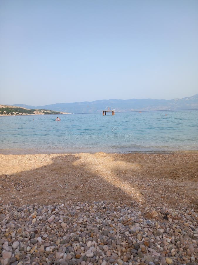 Beach Sky Mountain Rock Blue Jump Stock Photo - Image of jump, beach ...