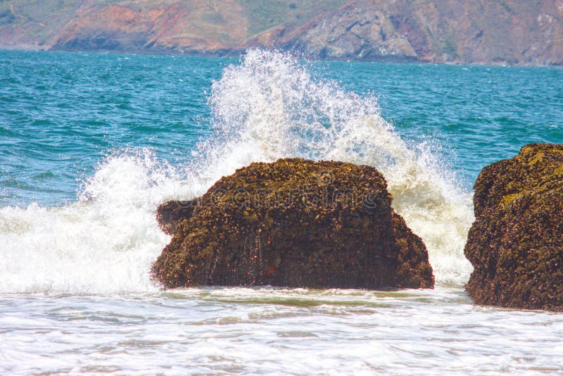 Beach slapped by a wave stock image. Image of rock, beach - 152766123