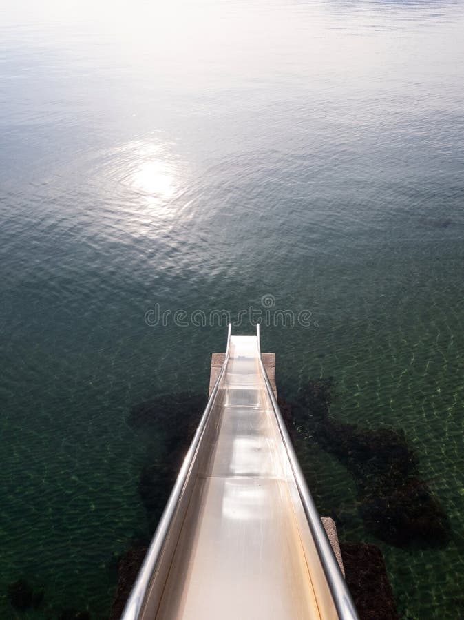 Beach slide into the sea stock photo. Image of cloud - 177734330
