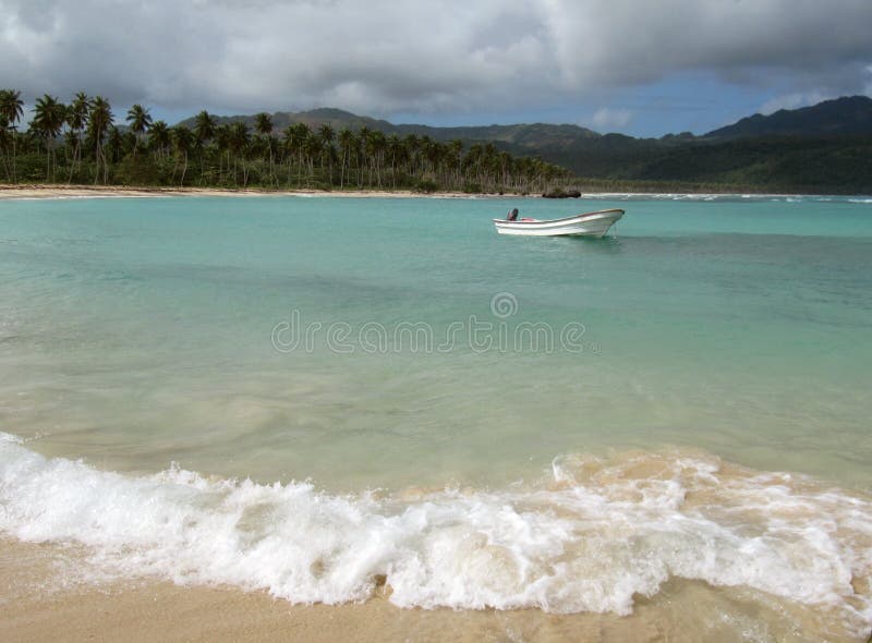 Beach and small boat stock image. Image of ocean, holiday - 19040185