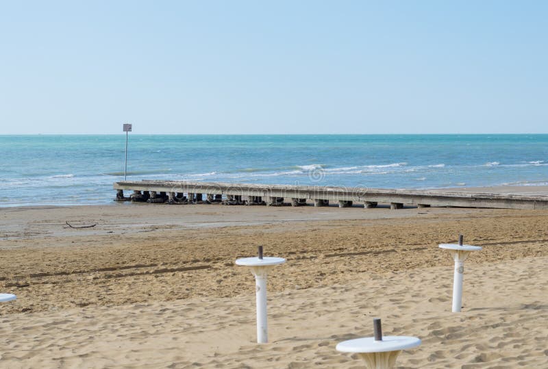 Beach at the Spring with Wooden Pier Stock Photo - Image of tranquil ...