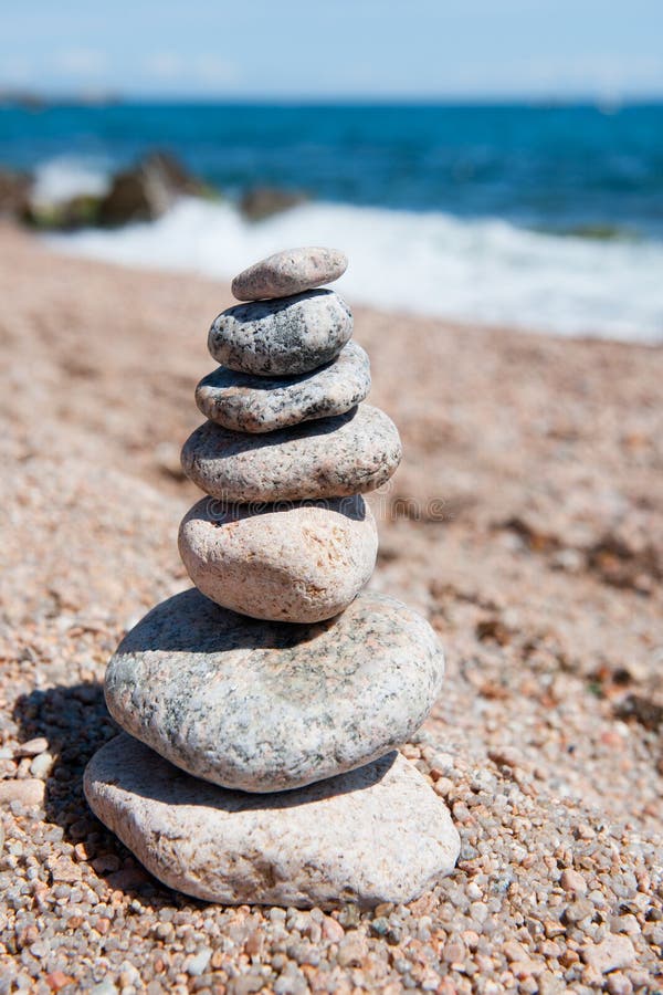 Beach with stacked stones stock image. Image of summer - 15002347