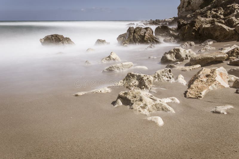Beach and stones stock photo. Image of wild, surf, weaves - 99911554
