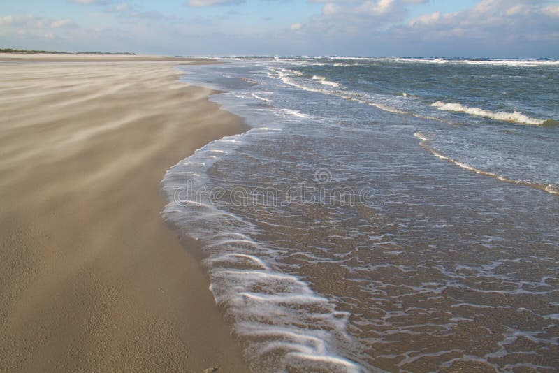 Beach with Drifting Sand and Foam on the Water Stock Photo - Image of ...