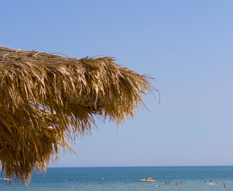Beach and Sun Straw Umbrella on Beach Stock Photo - Image of sand ...