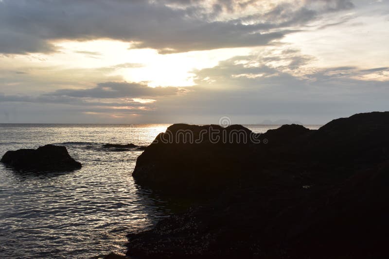 Beach Sunrise and Rocks stock photo. Image of terengganu - 122578696