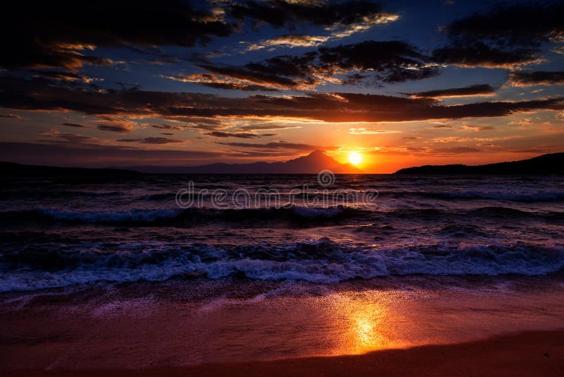 Beach at sunrise stock photo. Image of overcast, windy - 62590348