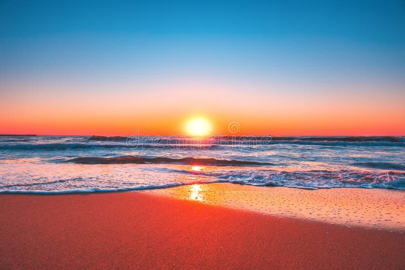Beach Sunrise or Sunset with Clear Blue Sky and Rising Sun Stock Photo ...