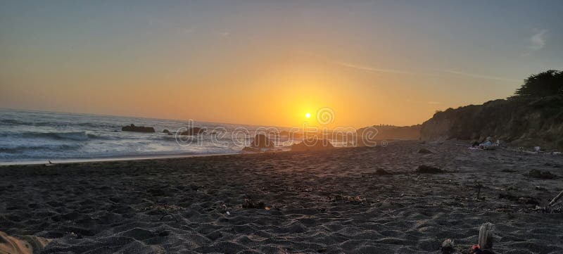 Beach sunset on cambrea stock photo. Image of sunlight - 227128438