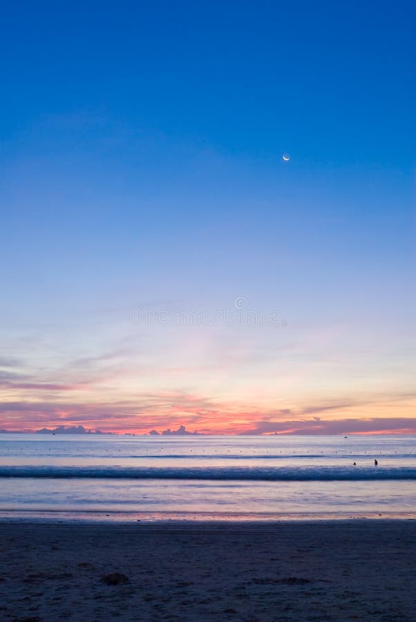 Beach Sunset with a Half-moon Stock Photo - Image of clear, cloudscape ...