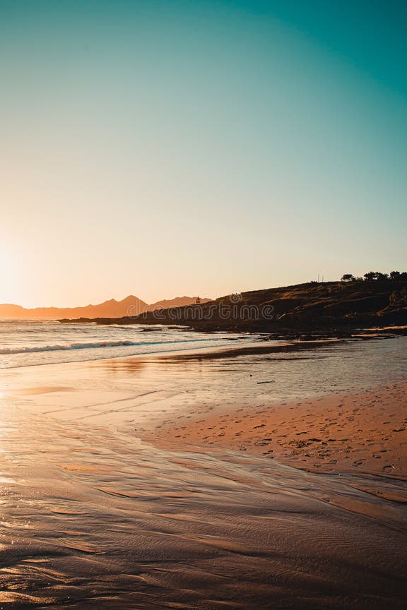 Beach at Sunset in Teal and Orange Water Stock Image - Image of teal ...