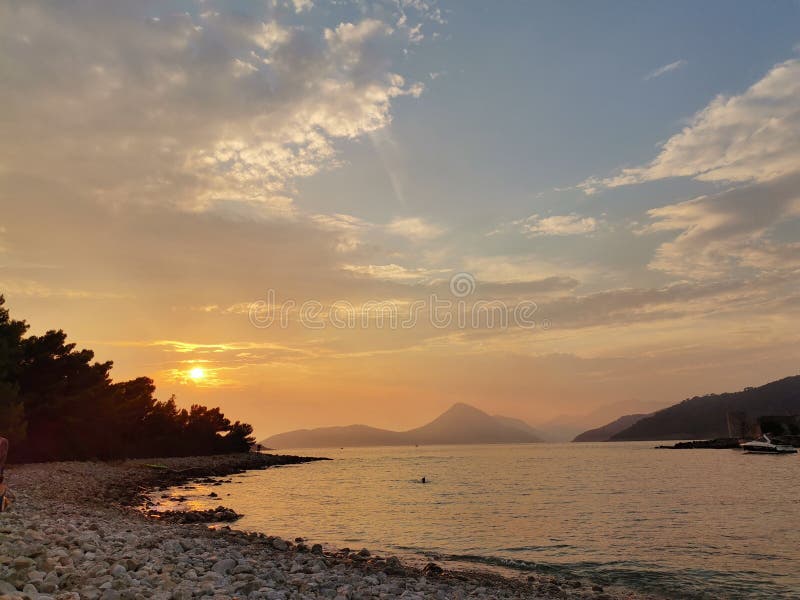 Beach sunset view stock image. Image of sunlight, afterglow - 256834643